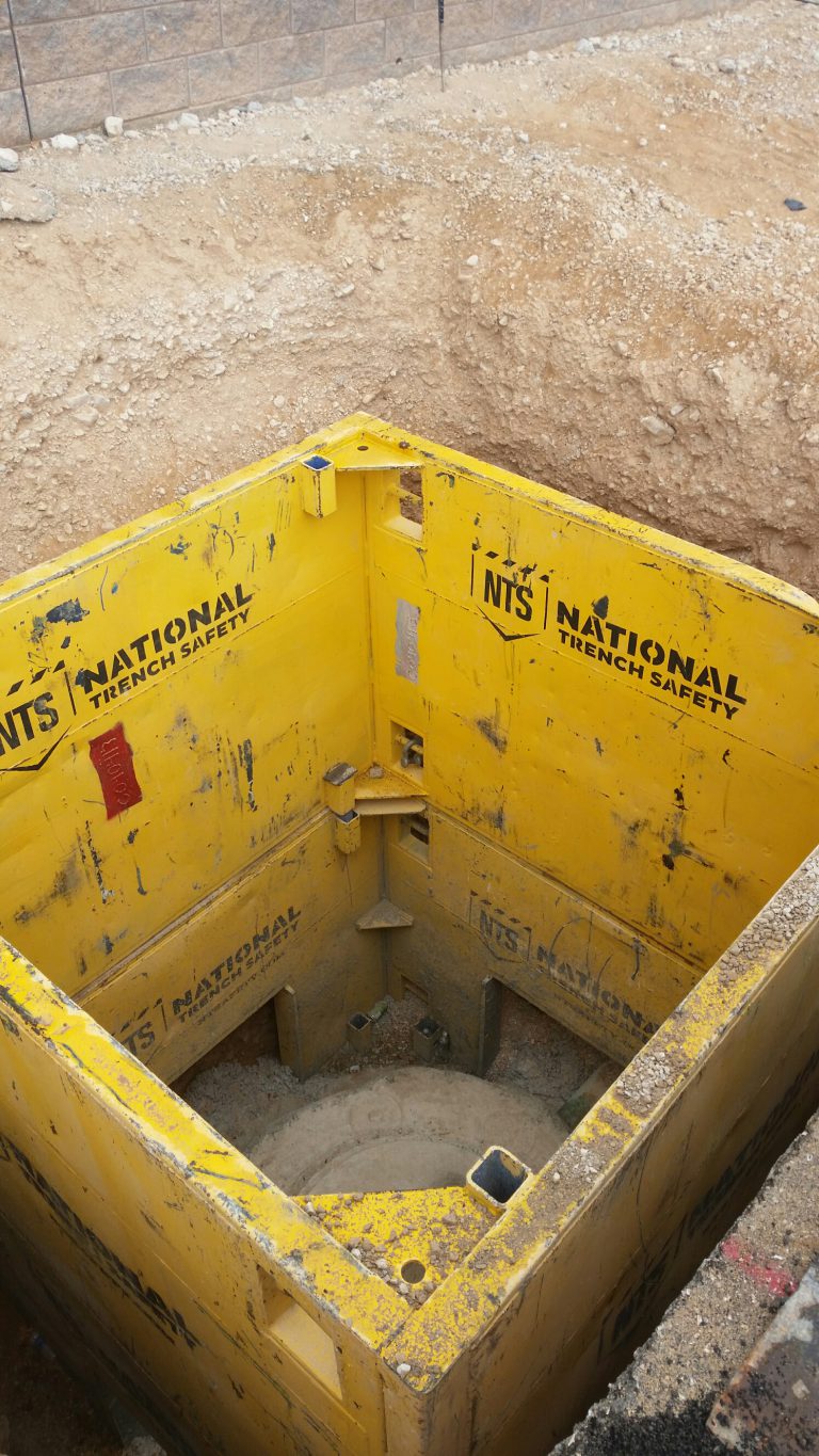 Steel Manhole Shields Used During Water and Sewer Tie-In | Trench and ...